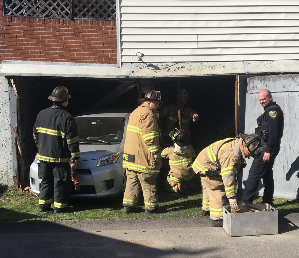 No one injured when car hits into garage in Uniontown - Herald-Standard